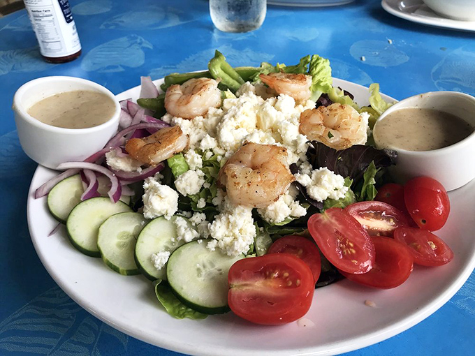 A salad that doesn't apologize for being healthy—it's too busy showing off those plump shrimp and that crumbled feta that's playing hard to get.