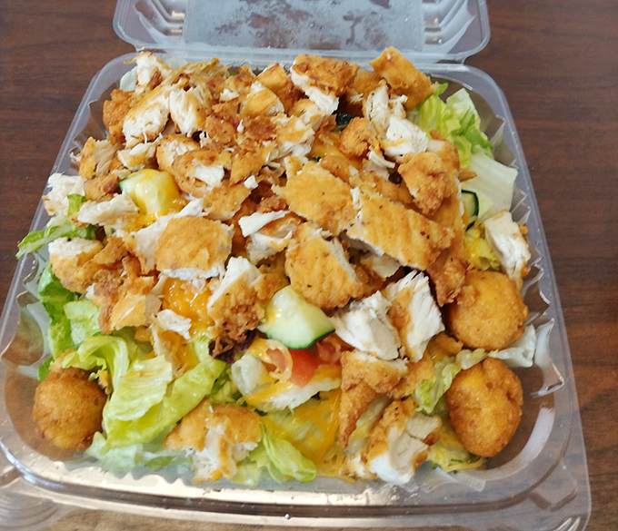 When you need something green but can't abandon barbecue—crispy chicken atop fresh greens creates the illusion of health with all the satisfaction.
