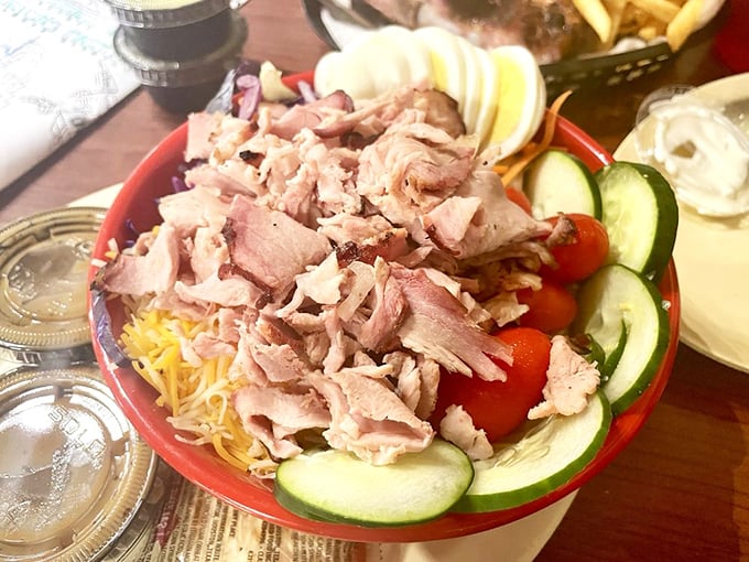 A salad that doesn't apologize for being at a barbecue joint. That turkey isn't a topping—it's the reason vegetables showed up in the first place.