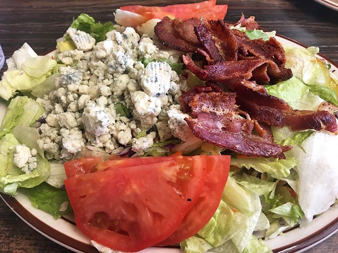 A salad that doesn't apologize for the bacon—proof that even the "healthy option" at a great diner knows how to have fun.