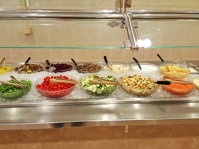 A salad bar that proves vegetables can be exciting too—fresh, colorful ingredients waiting to balance out all those breakfast indulgences.