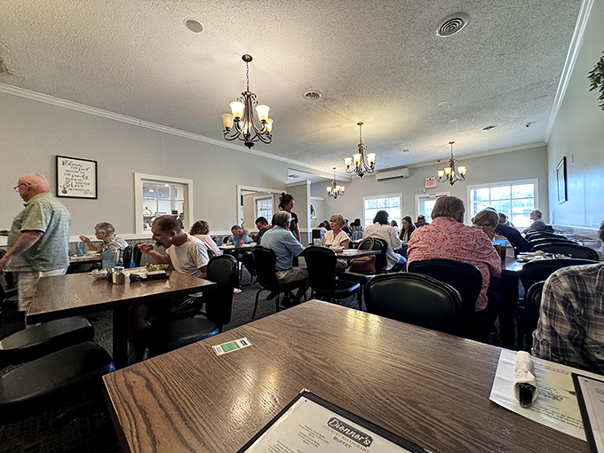 The dining room hums with the satisfied murmurs of happy eaters. Those chandeliers add a touch of elegance to this temple of comfort food.