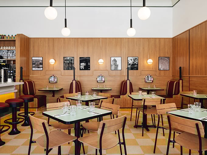 The dining room feels like the living room of your coolest friend—if that friend had impeccable taste in mid-century furniture and lighting.