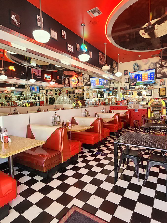 Red booths lined up like classic Chevys at a drive-in, each one a front-row seat to the greatest show on plates.