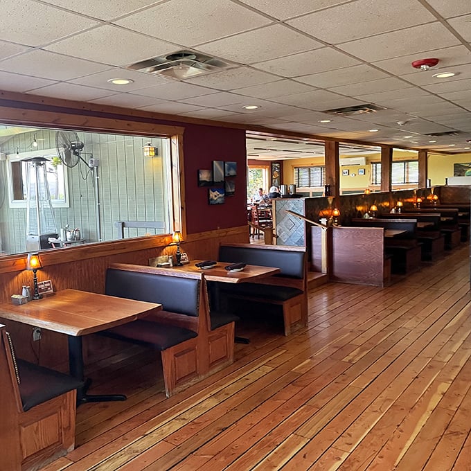 The dining room's wooden booths and warm lighting invite you to settle in and stay awhile—possibly until your next meal.