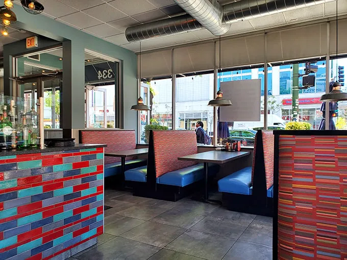 Modern diner aesthetics with colorful tile work and comfortable booths—the perfect setting for contemplating a second helping of French toast.