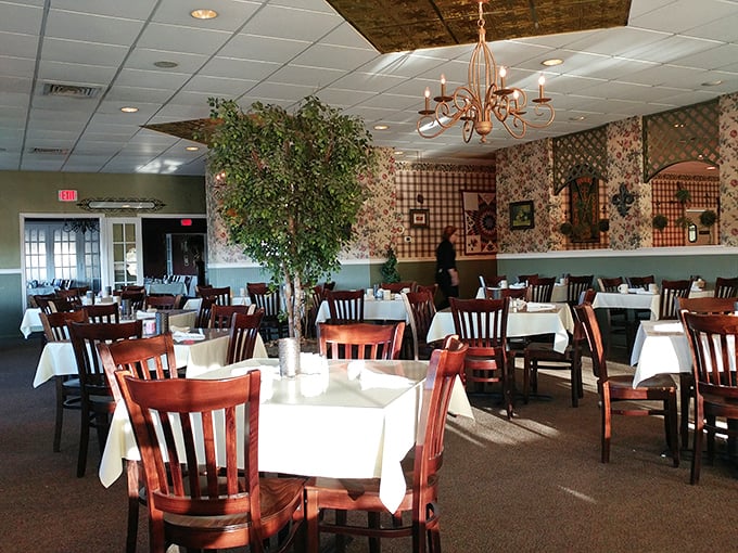 The dining room whispers "stay awhile" with its warm lighting and country charm—a stage set for breakfast drama.