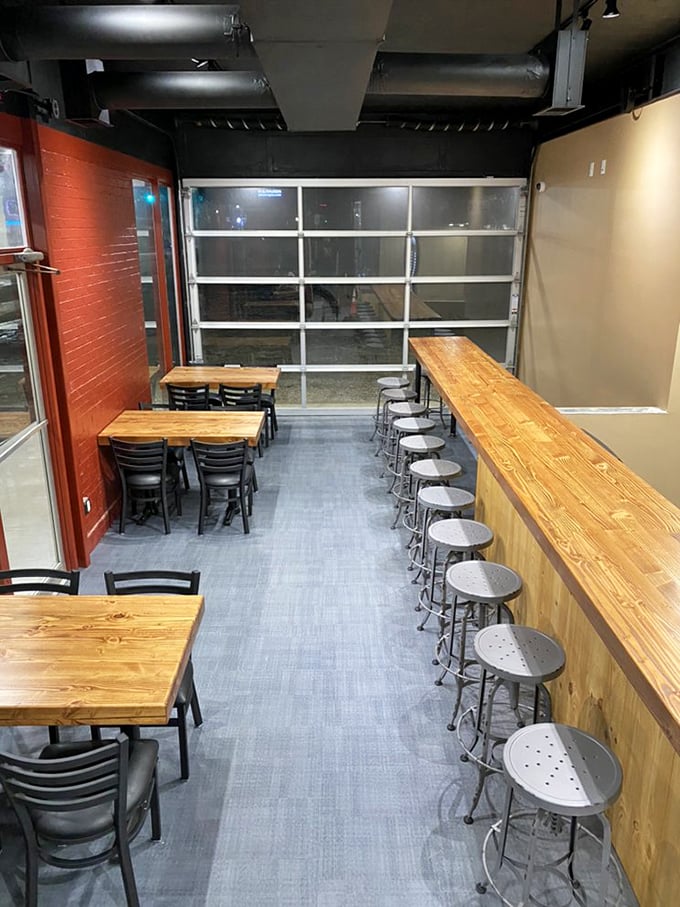 The bar area invites lingering conversations and second rounds, where strangers become friends over shared appreciation of smoke and sauce.