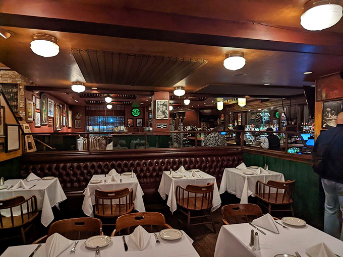 Cozy banquettes and warm lighting create the perfect setting where business deals and anniversary dinners happen with equal success.