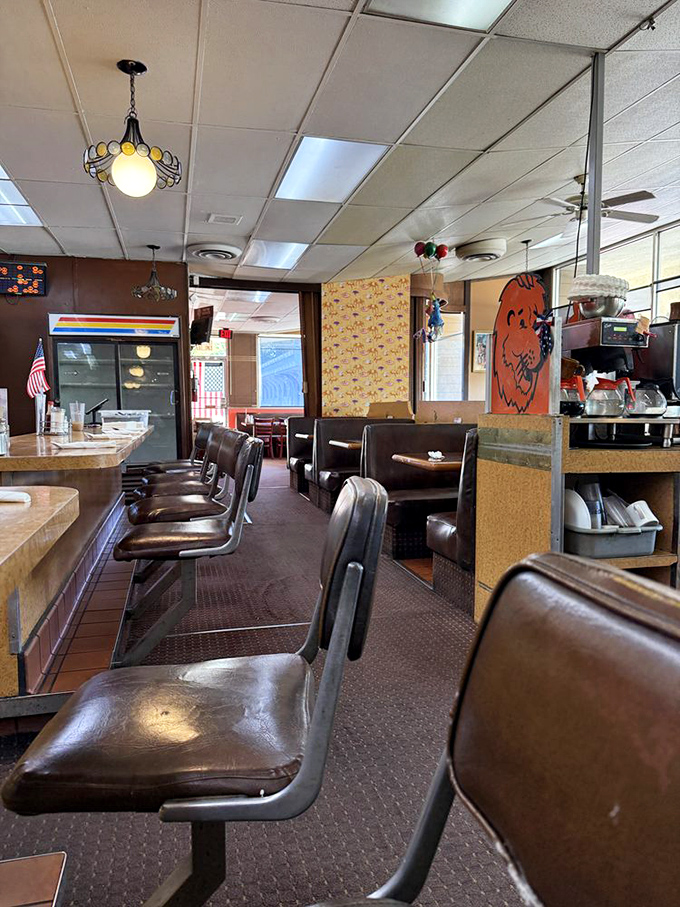 Counter seating where breakfast dreams come true—these well-worn stools have supported generations of pancake enthusiasts.