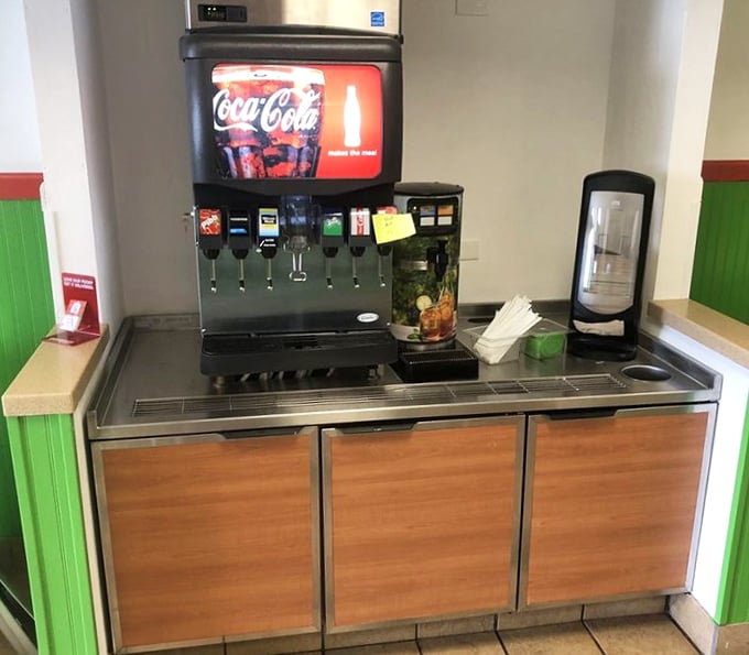 The self-service beverage station stands ready to provide the perfect liquid companion to your sandwich masterpiece – because great food deserves proper hydration.