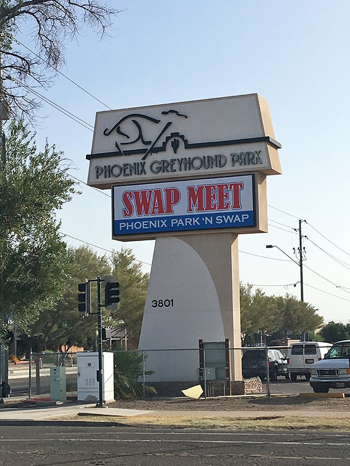 The gateway to bargain paradise! This retro sign stands as a beacon to deal-hunters, promising treasures within the former Greyhound Park grounds.