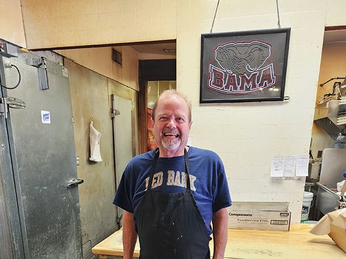 The smile of someone who knows his smoke ring is perfect. BBQ isn't just food here—it's a calling.
