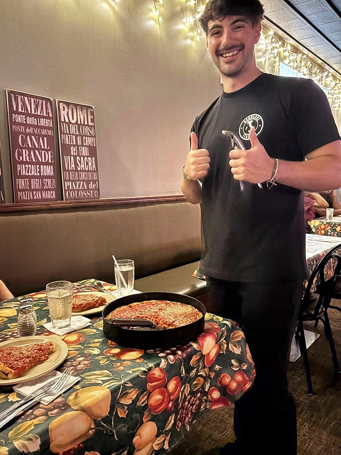 The thumbs-up says it all—when you're serving pizza this good, confidence comes naturally.