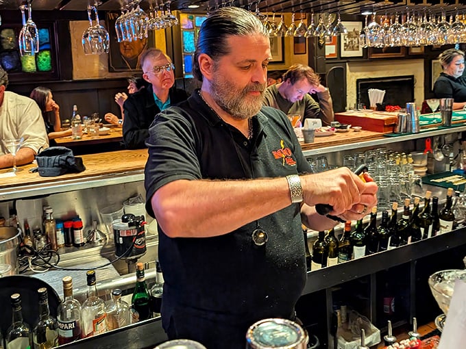 When your bartender looks this serious, you know that Old Fashioned is going to be perfect.