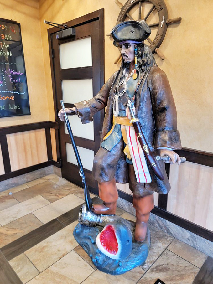 This pirate statue stands guard over the seafood bounty. He's seen things—mostly people with butter-stained shirts leaving happy.