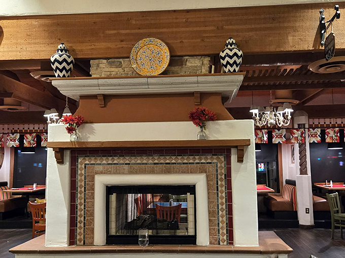 A cozy fireplace adds warmth to an already welcoming space that feels like home immediately.