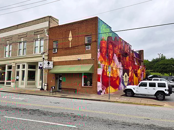 The vibrant mural celebrates Macon's musical heritage, a colorful backdrop to the soulful flavors waiting inside this brick cornerstone.