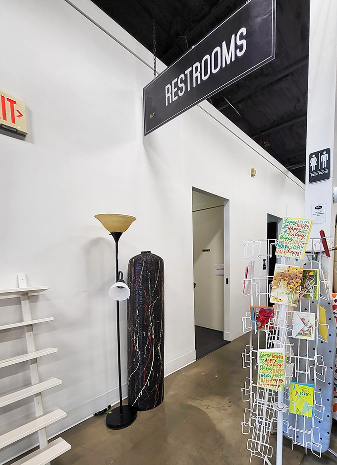 Even the path to the restrooms offers shopping opportunities—proof that at Mission Thrift, no square footage goes to waste.