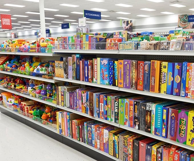 The toy section explodes with color and possibility. Board games with most pieces intact sit alongside childhood memories waiting to be rediscovered.
