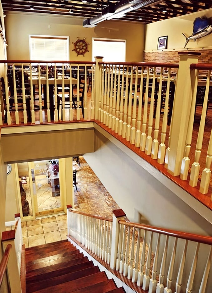 The upper dining area offers a captain's view of the restaurant below—nautical elegance without having to worry about seasickness.