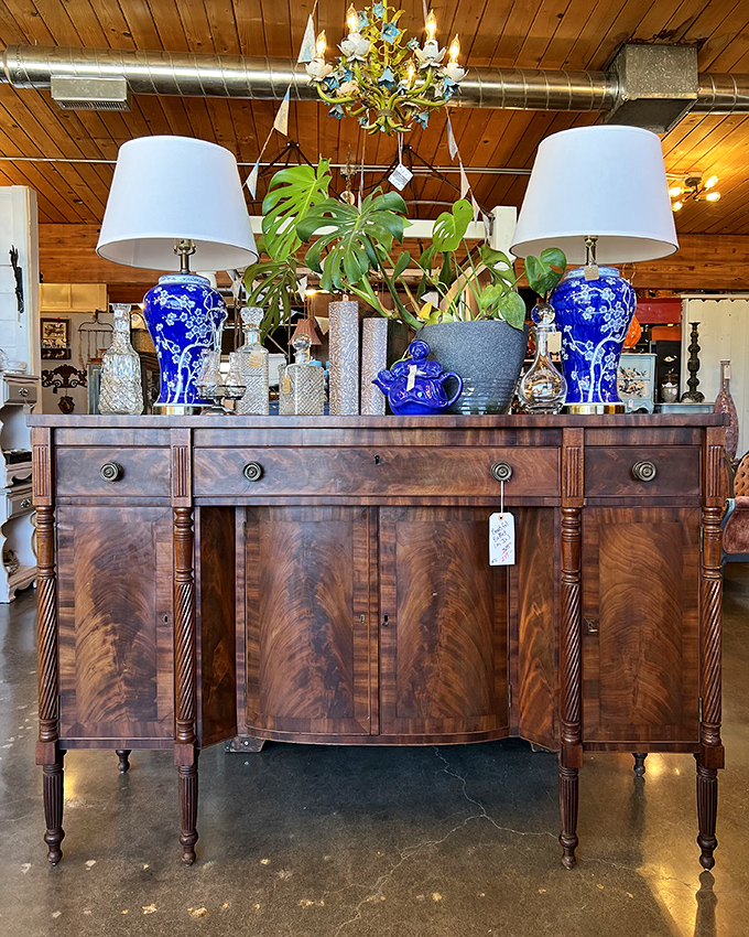 This isn't just a sideboard—it's functional art. The rich mahogany finish and classic lines would make even Marie Antoinette jealous.
