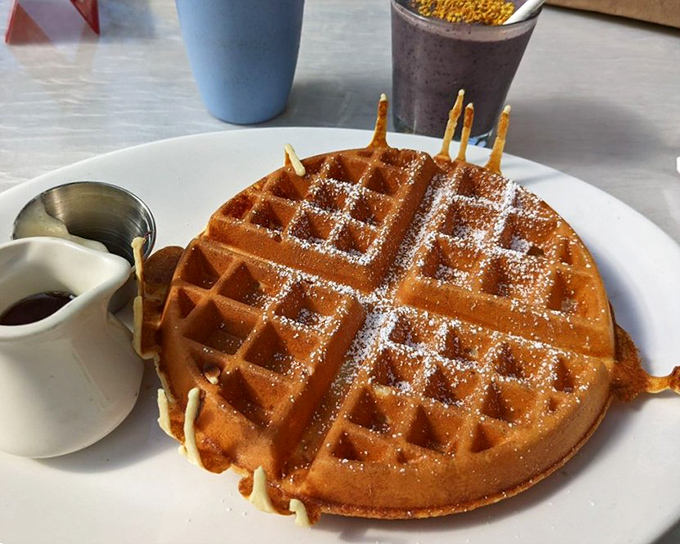 The perfect waffle doesn't exi— Oh wait, here it is. Golden, crisp exterior hiding fluffy secrets within. Maple syrup standing by.