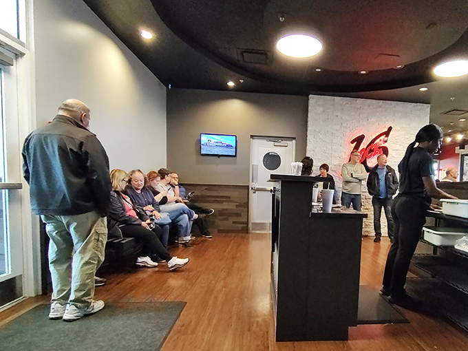 The waiting area speaks volumes: when people willingly stand by for a table, you know what awaits is worth every minute of anticipation.