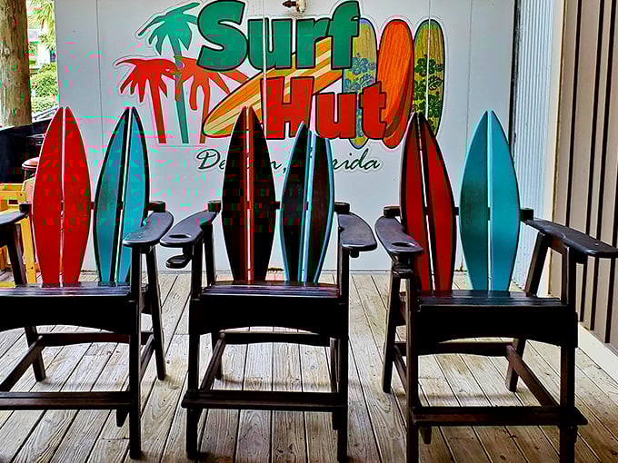 Adirondack chairs shaped like surfboards—because regular chairs weren't beachy enough. The perfect spot to contemplate life while waiting for your table.