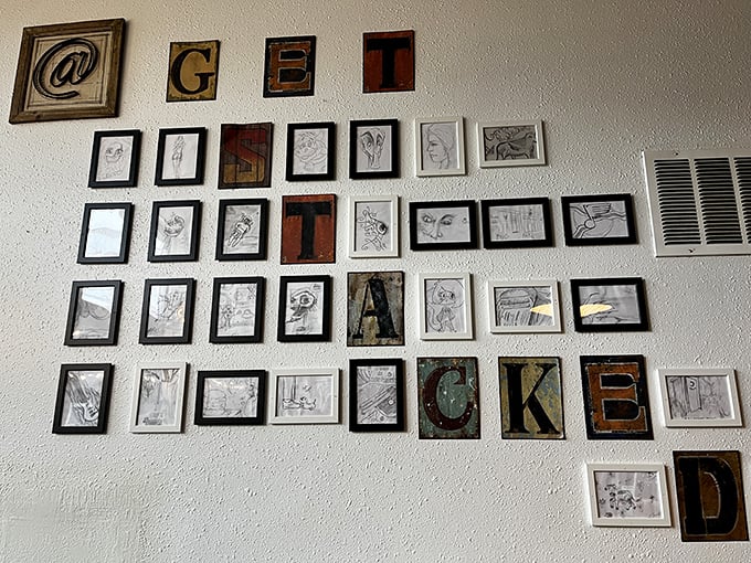 Wall art that spells out "GET STACKED" surrounded by sketches—because great food deserves its own gallery exhibition.