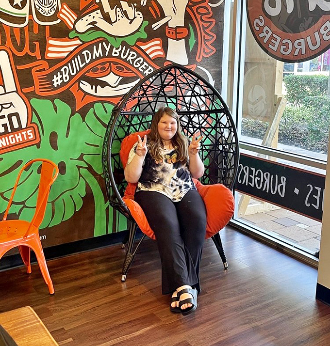 The egg chair by the window—prime real estate for people-watching while contemplating life's important questions, like "Another shake?"
