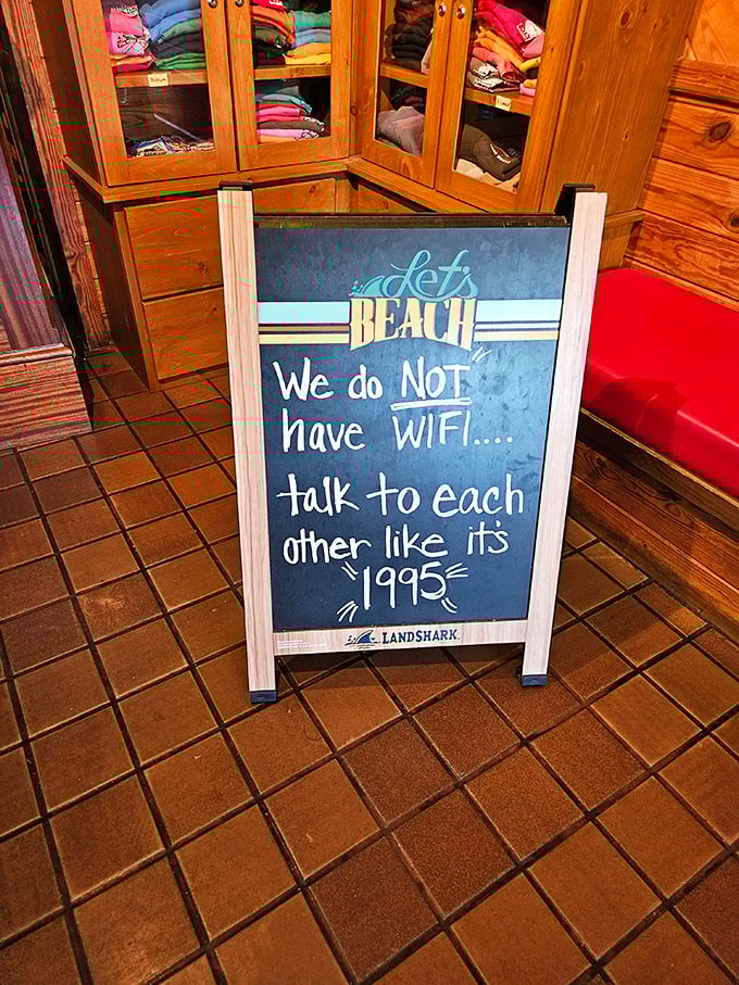 "We do NOT have WiFi... talk to each other like it's 1995." A reminder that some traditions, like conversation over crab, never go out of style.