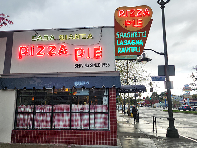 Casa Bianca's iconic neon sign has lit up Eagle Rock nights since 1955, a glowing testament to pizza permanence.