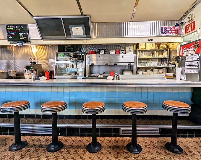 The counter view—where solo diners become regulars, and regulars become family. Blue tile never looked so inviting.