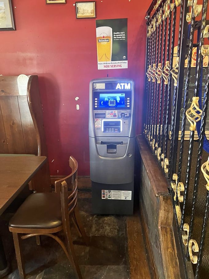 Even the ATM looks at home against the red wall – because after tasting that Shepherd's Pie, you'll want cash for another round.