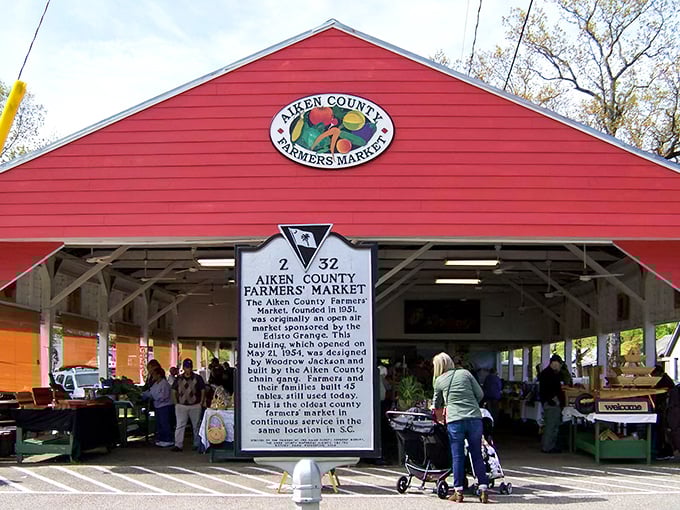 The Aiken County Farmers Market's bright red barn has been connecting local farmers with hungry shoppers since 1952—farm-to-table before it was trendy.