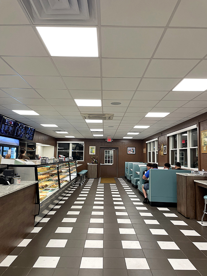 The checkered floor leads the eye straight to the display case – a yellow brick road for grown-ups with better rewards than Oz.