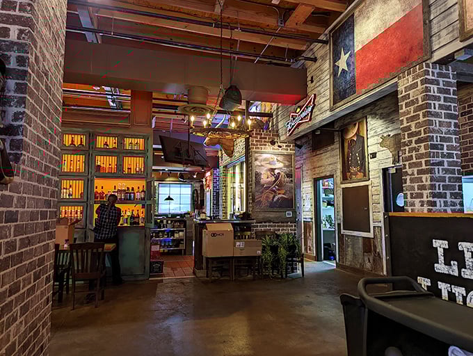 Texas flags, exposed brick, and warm lighting create an atmosphere that says, "Relax, friend—serious flavor is heading your way."