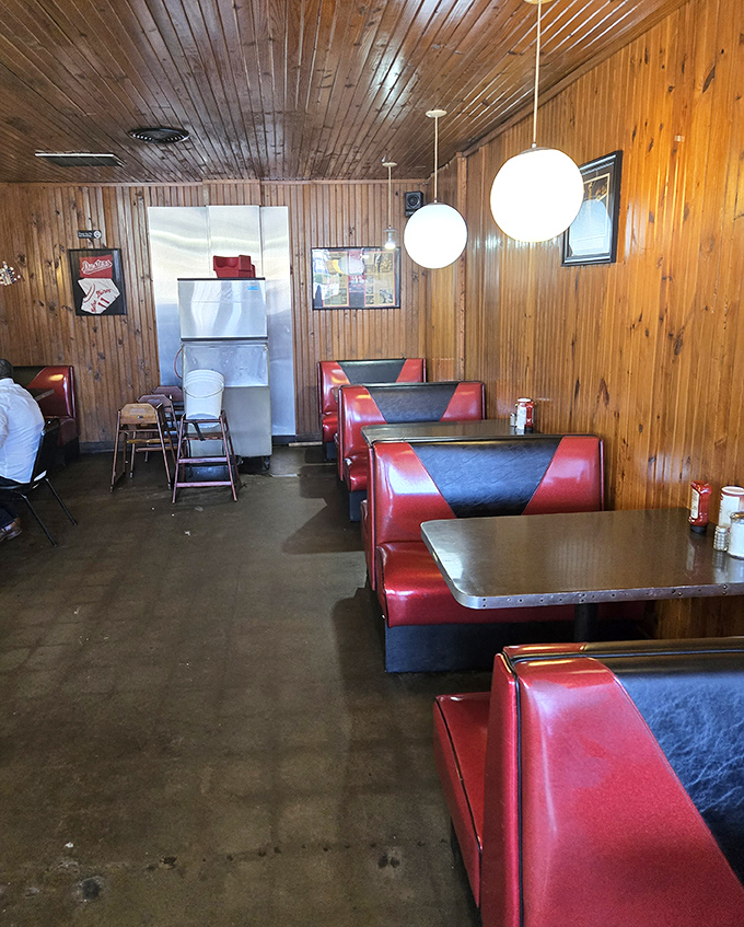 Empty booths never look lonely here—they look like possibilities waiting to happen over plates of comfort food.