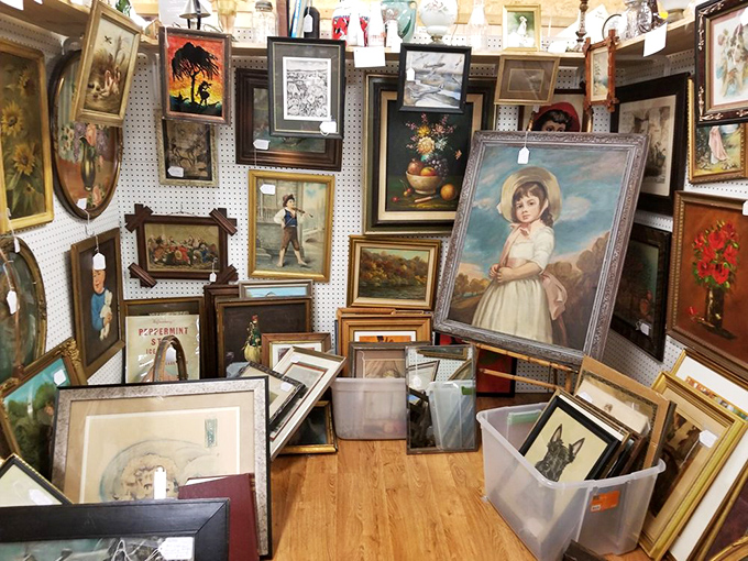 The wall of forgotten portraits—someone loved these faces enough to frame them. Now they wait patiently for new homes and fresh stories. 