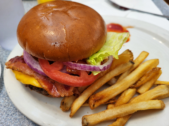 A burger that requires both hands and several napkins – the universal sign of something worth every messy bite.