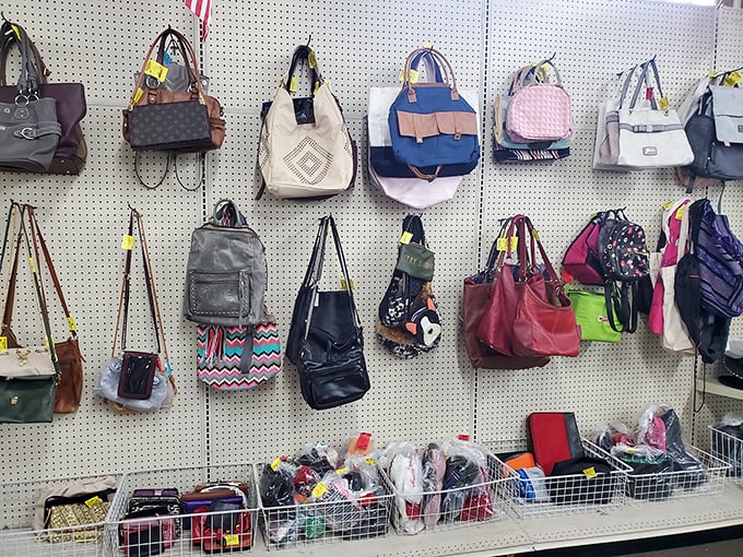Handbag heaven on pegboard display – where designer knockoffs mingle with authentic treasures, all waiting for their second act in society.