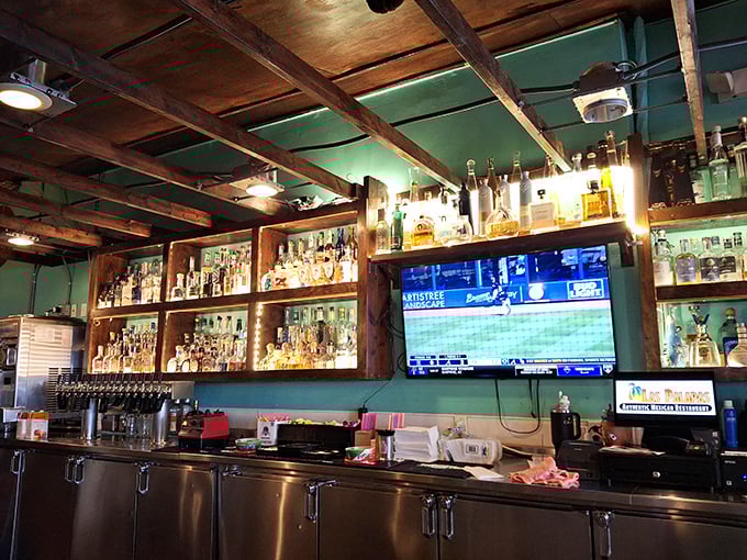 A bar stocked for serious margarita business. With tequila bottles gleaming like liquid gold, this is where Michigan's winter blues come to die.