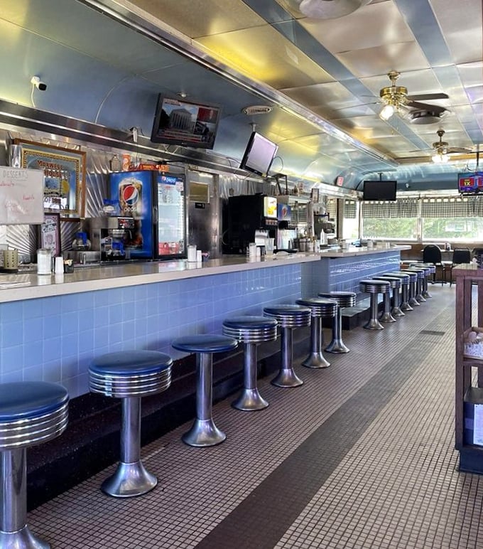 Blue-tiled counter and chrome stools stand ready for the morning rush—a diner's front row seats to the greatest breakfast show in Maryland.