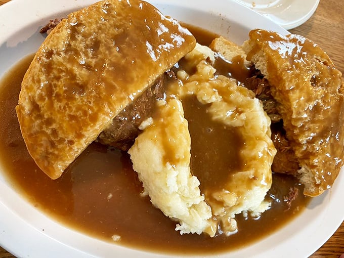 The legendary Hot Roast Beef sandwich—where mashed potatoes and gravy create a comfort food landscape that feels like a warm hug from grandma.