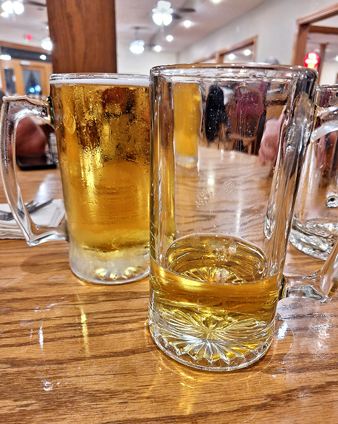 Cold beer in frosty mugs—some traditions don't need improving. The condensation tells you everything you need to know about refreshment.