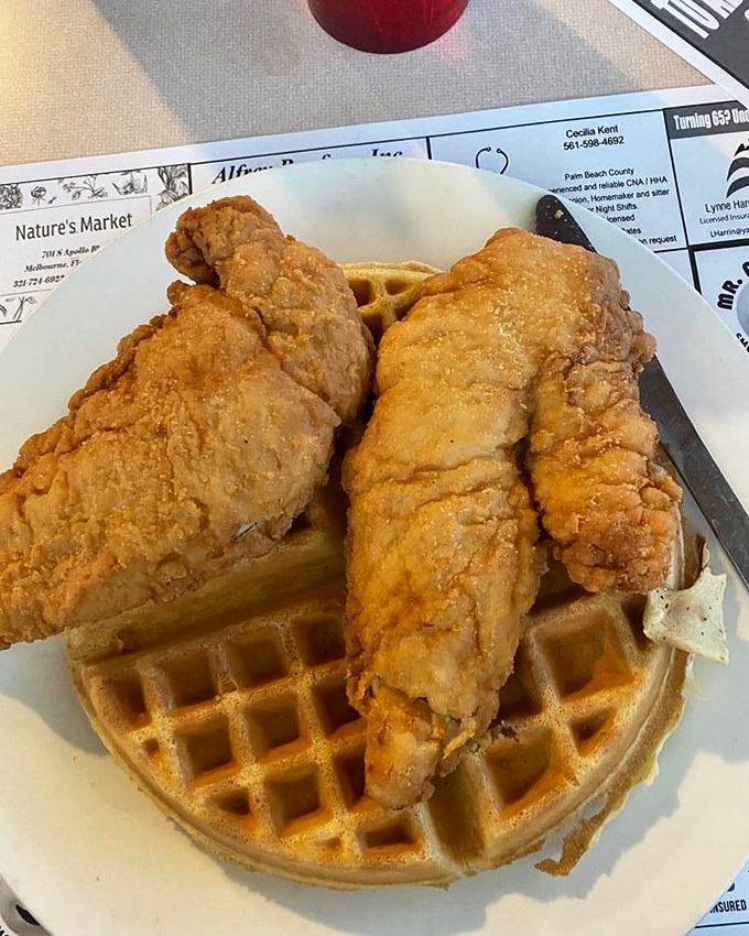 These golden-fried chicken tenders atop a Belgian waffle aren't just a meal—they're a declaration that breakfast rules don't apply here.