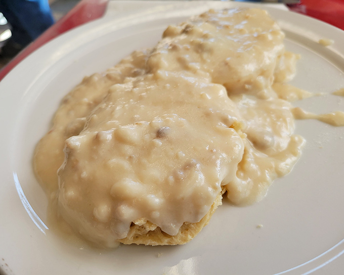 These biscuits and gravy aren't just breakfast—they're an edible hug that says "today's going to be alright." Comfort food personified.