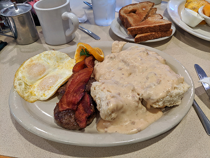 Biscuits and gravy with eggs and bacon—a breakfast so hearty it makes you wonder why brunch needed to get all fancy in the first place.