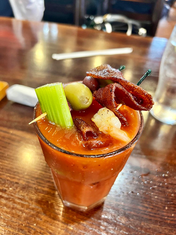 A Bloody Mary garnished with such enthusiasm it's practically a meal. The bacon strip is just showing off at this point.